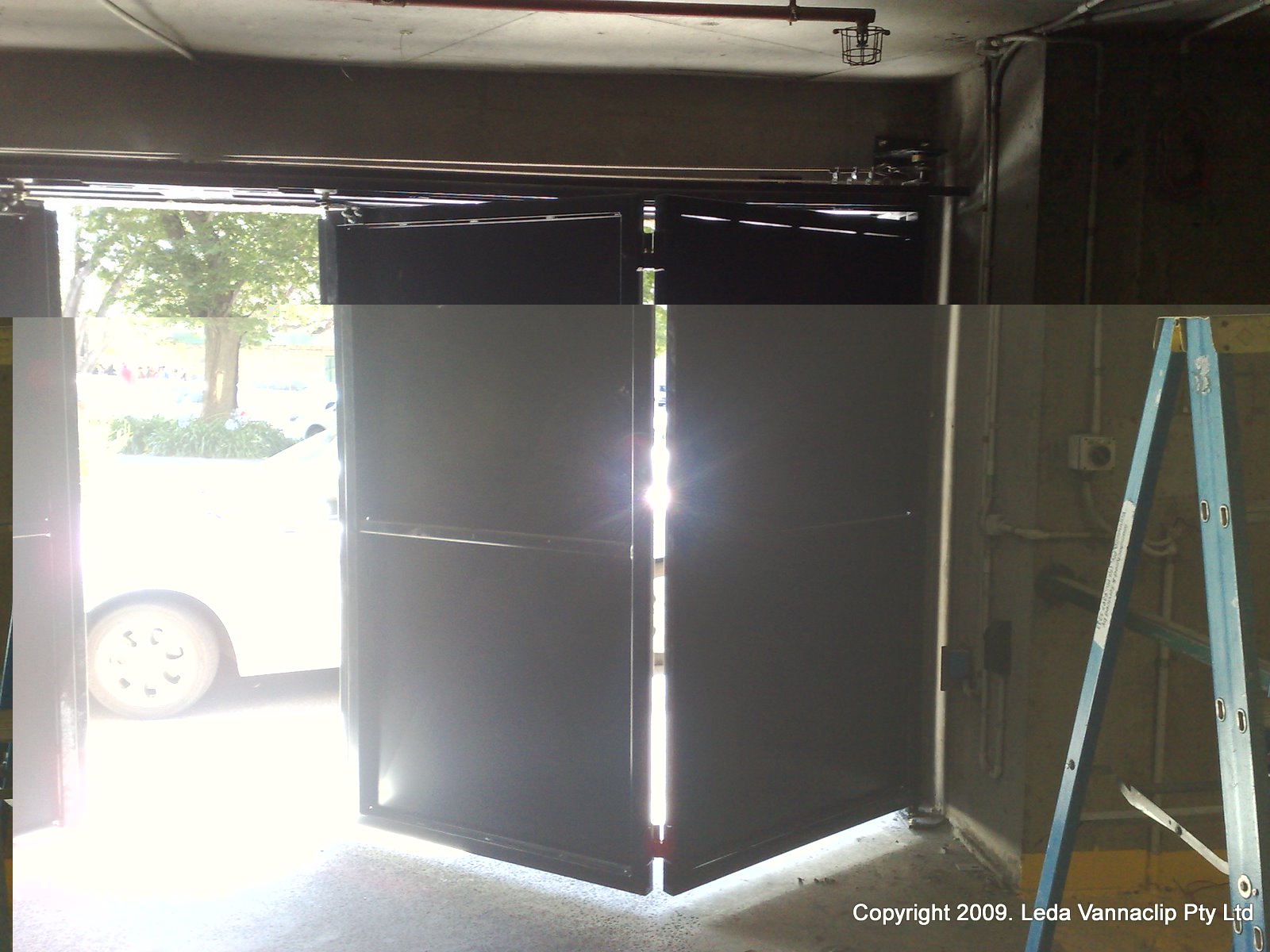 Industrial Overhead Track Bi-fold Gate | Leda Security Products